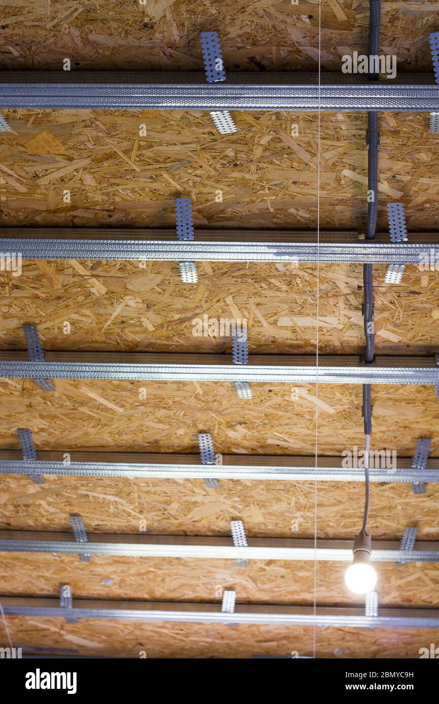 Installation of wiring in profile for drywall on chipboard plate ...