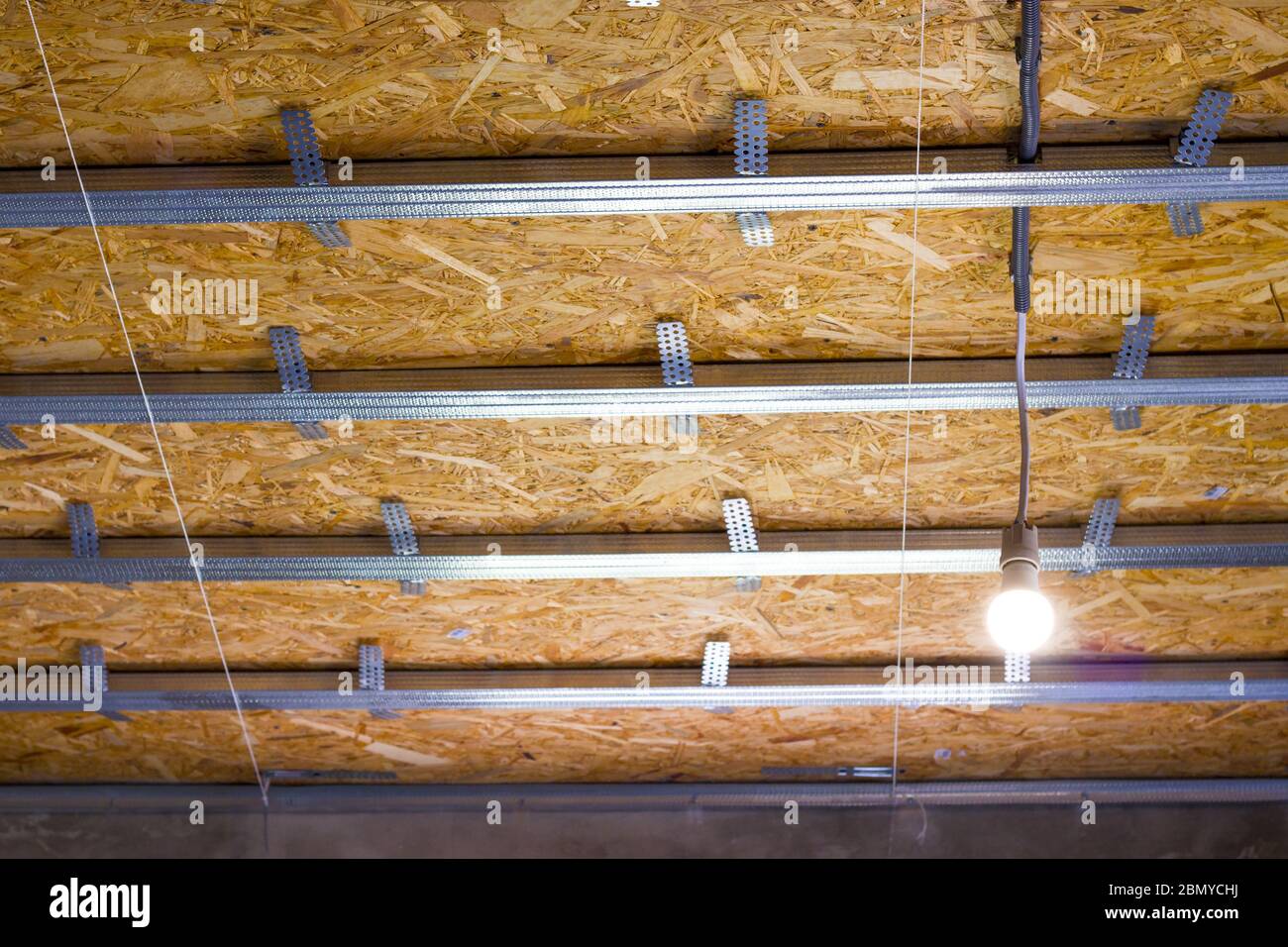 Installation of wiring in profile for drywall. Unfinished ceiling ...