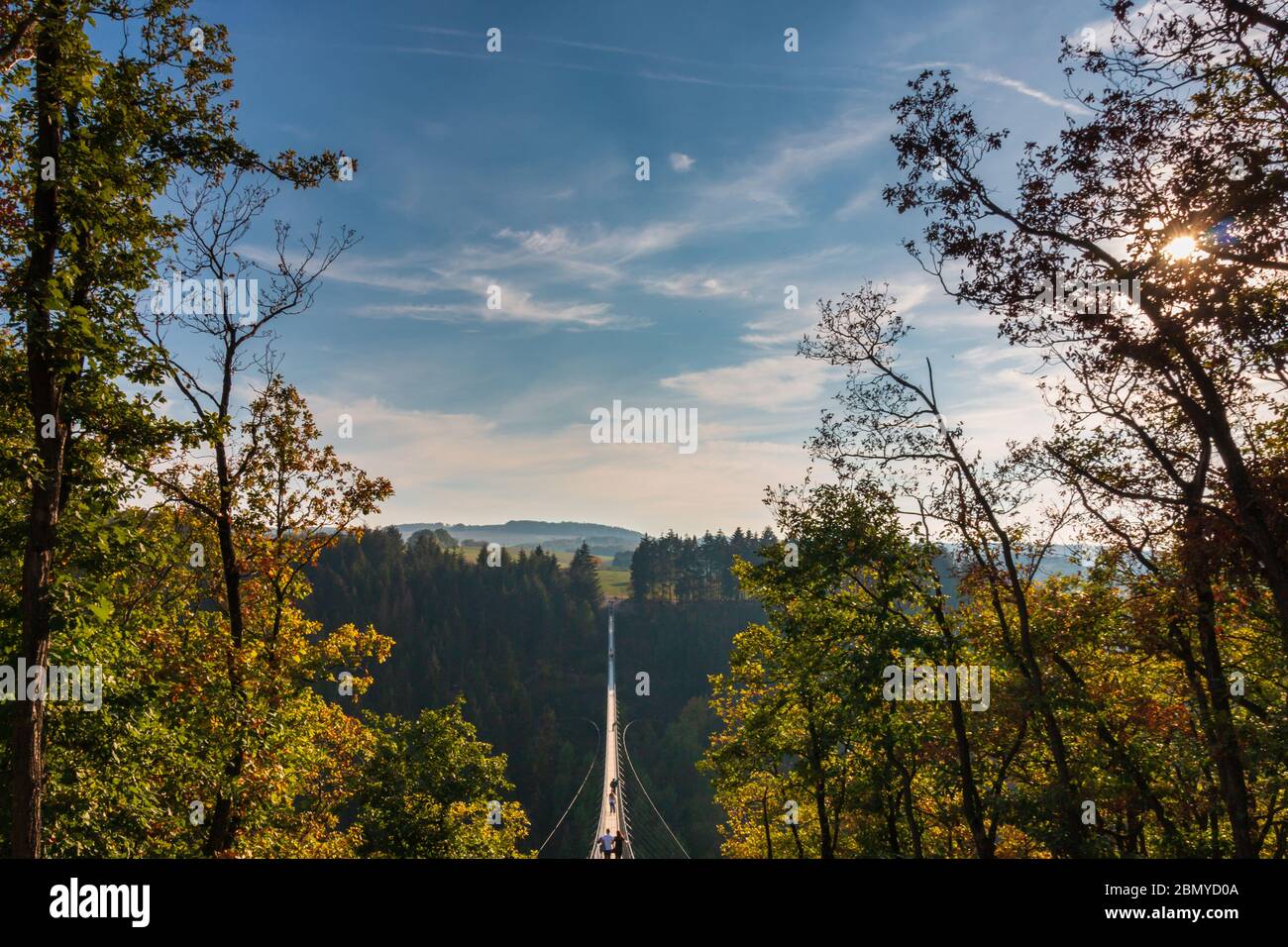 Visitors walking across Geierlay suspension bridge in the German region ...