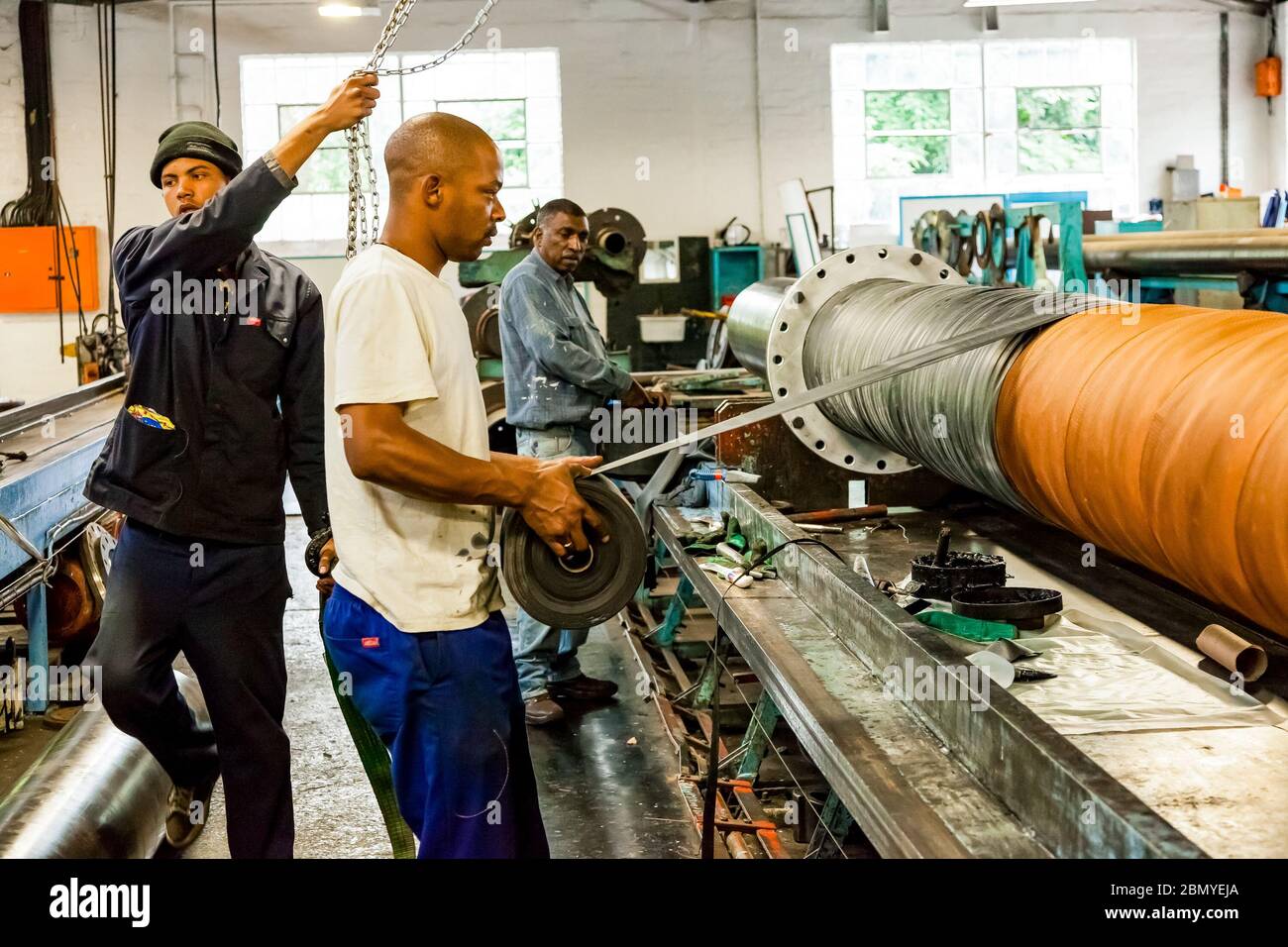Johannesburg, South Africa - October 19, 2012: Diverse workers inside a ...