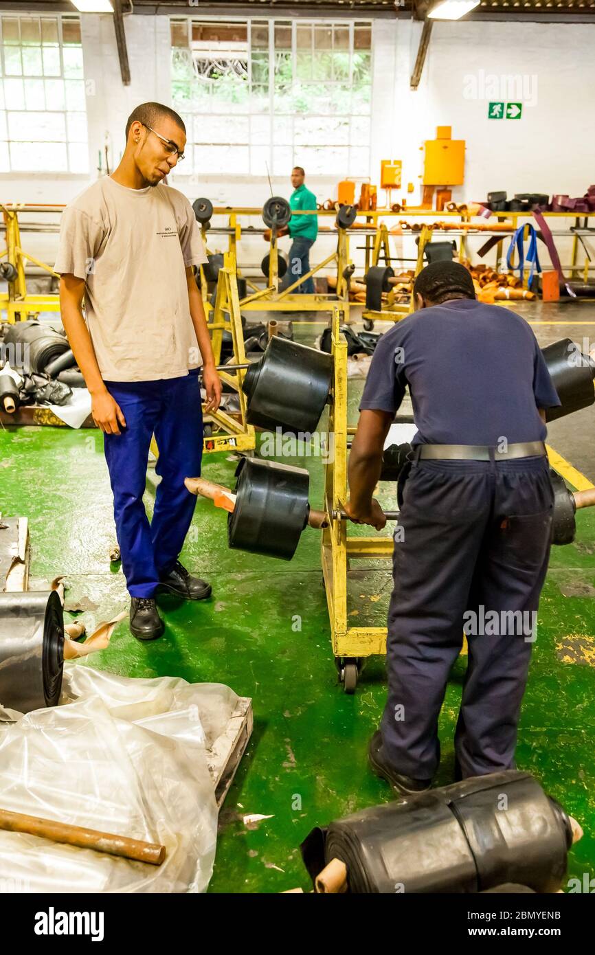 Johannesburg, South Africa - October 19, 2012: Diverse workers inside a ...