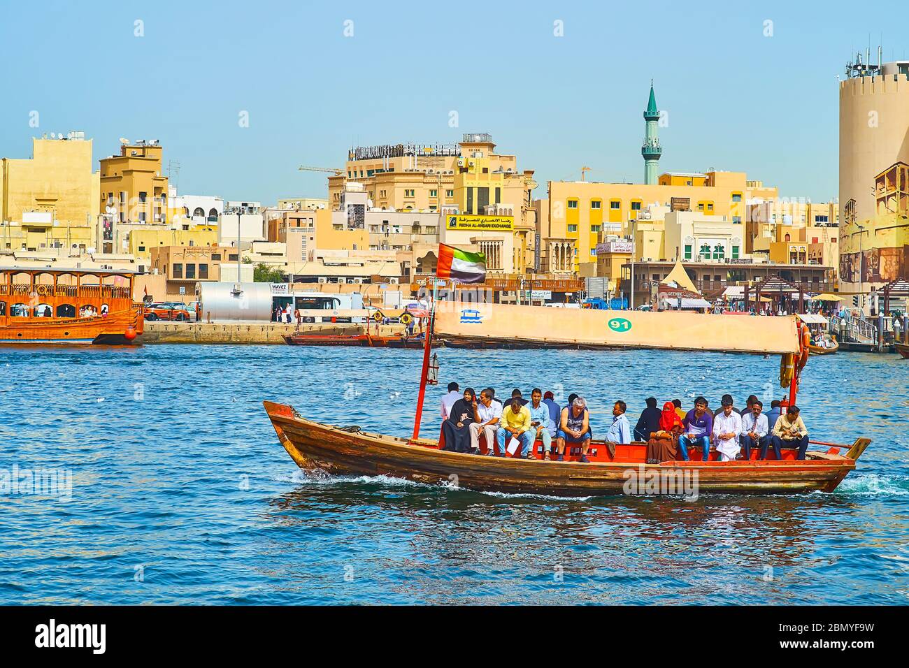 DUBAI, UAE - MARCH 2, 2020: The old abra boat with passengers is ...