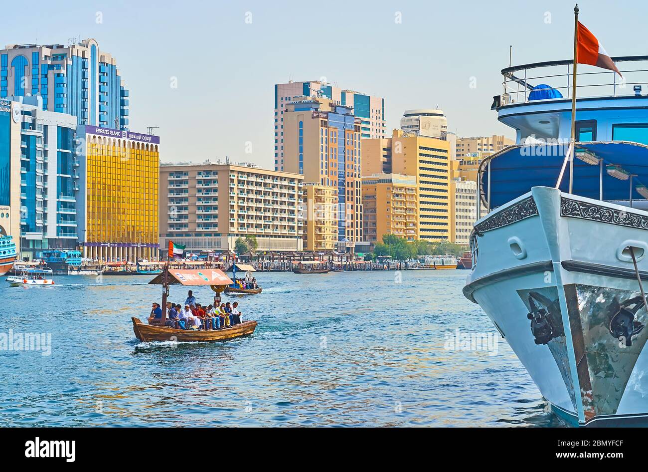DUBAI, UAE - MARCH 2, 2020: The abra boat floats along Dubai Creek with ...