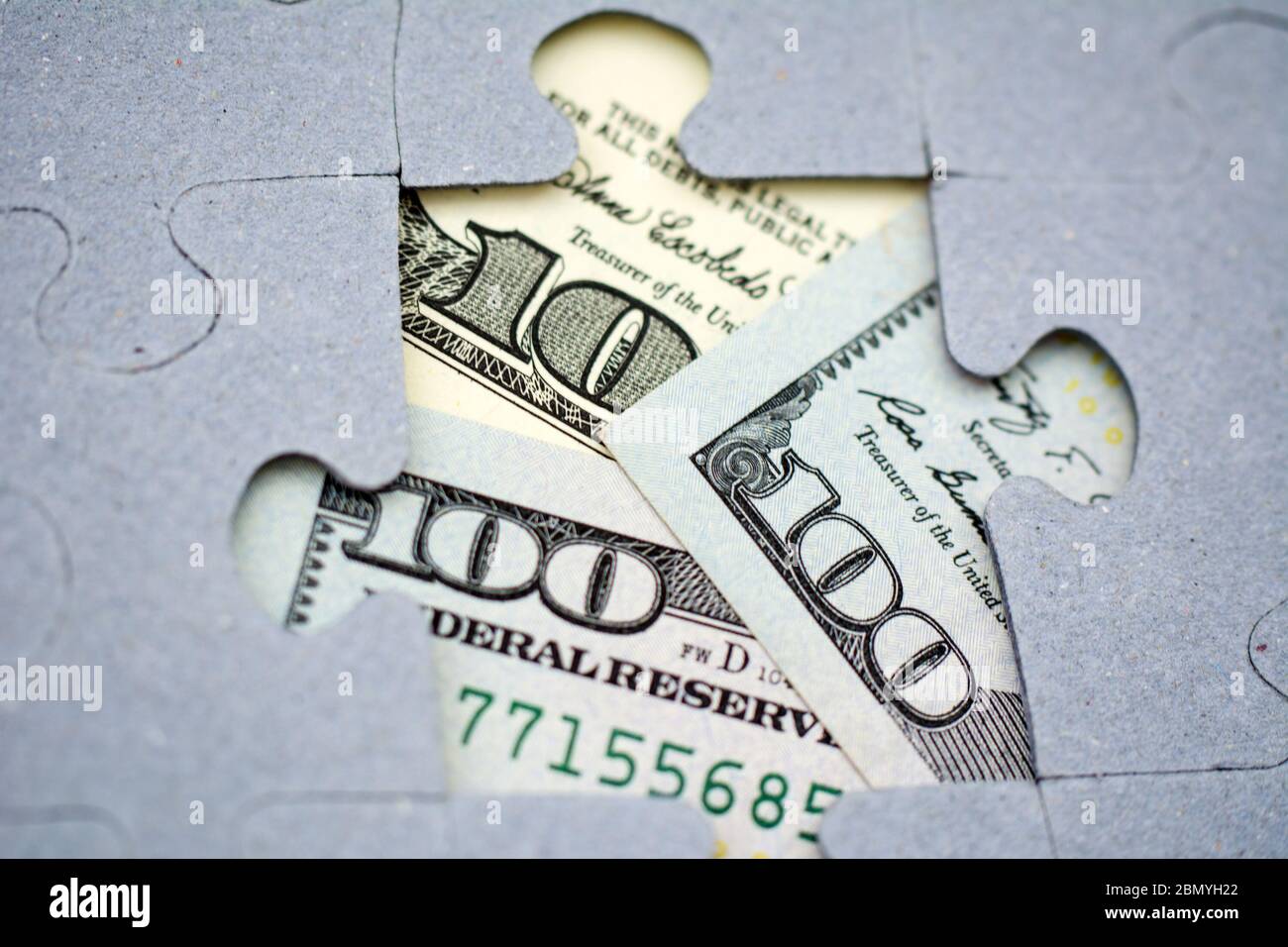 100 dollar bill puzzle hi-res stock photography and images - Alamy