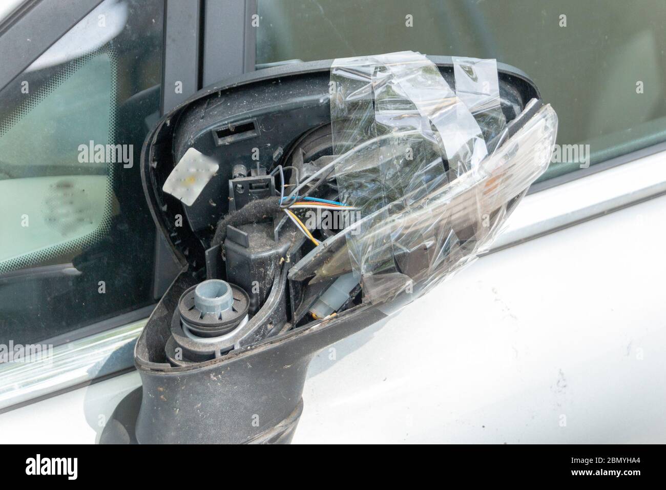 a close up view of a car-vehicle side mirror that has been damged and ...