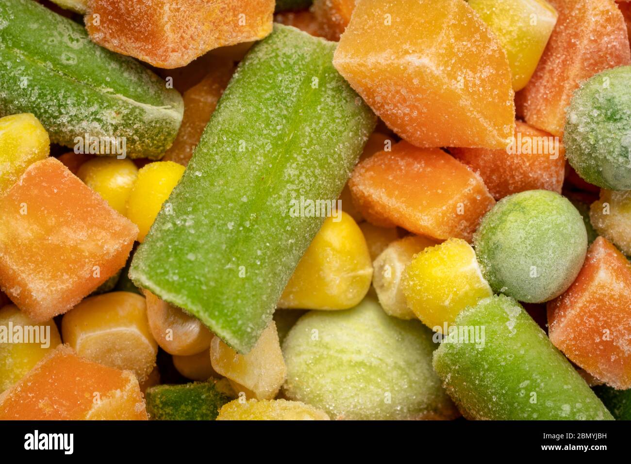 closeup background and texture of frozen vegetable medley - carrots ...