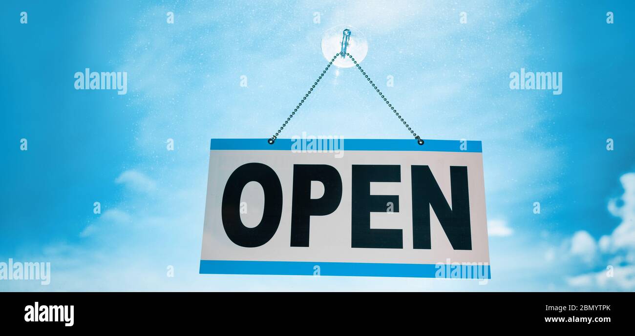 COVID-19 end of confinement stores reopening with OPEN sign hanging on ...