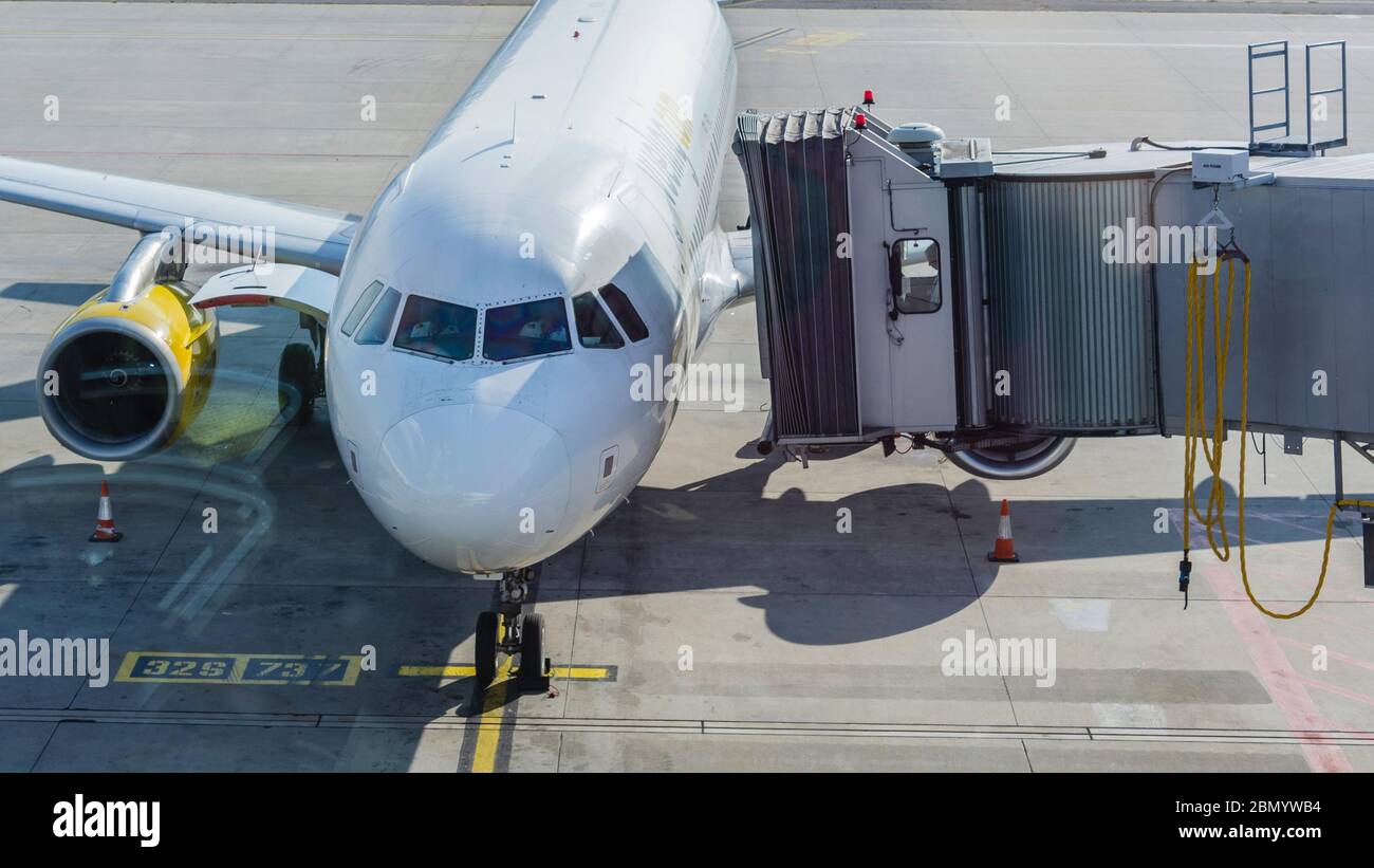 Aircraft being loaded at an airport on a day Stock Photo - Alamy