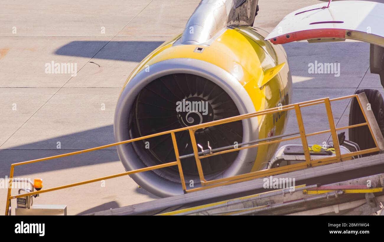 Aircraft being loaded at an airport on a sunny day Stock Photo - Alamy