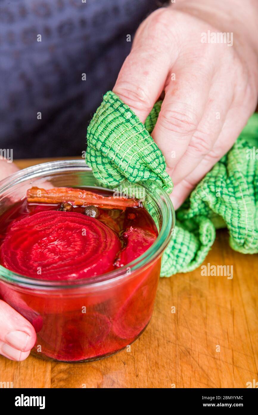 Wipe the jar rims carefully to assure a tight seal. This is a jar of ...