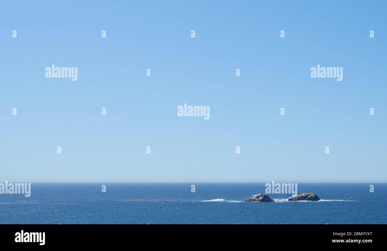 Two Islands in the Ocean Background Stock Photo - Alamy