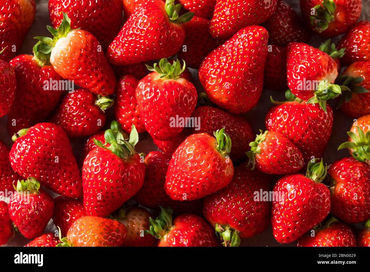 Raw Red Organic Strawberries in a Bunch Stock Photo - Alamy