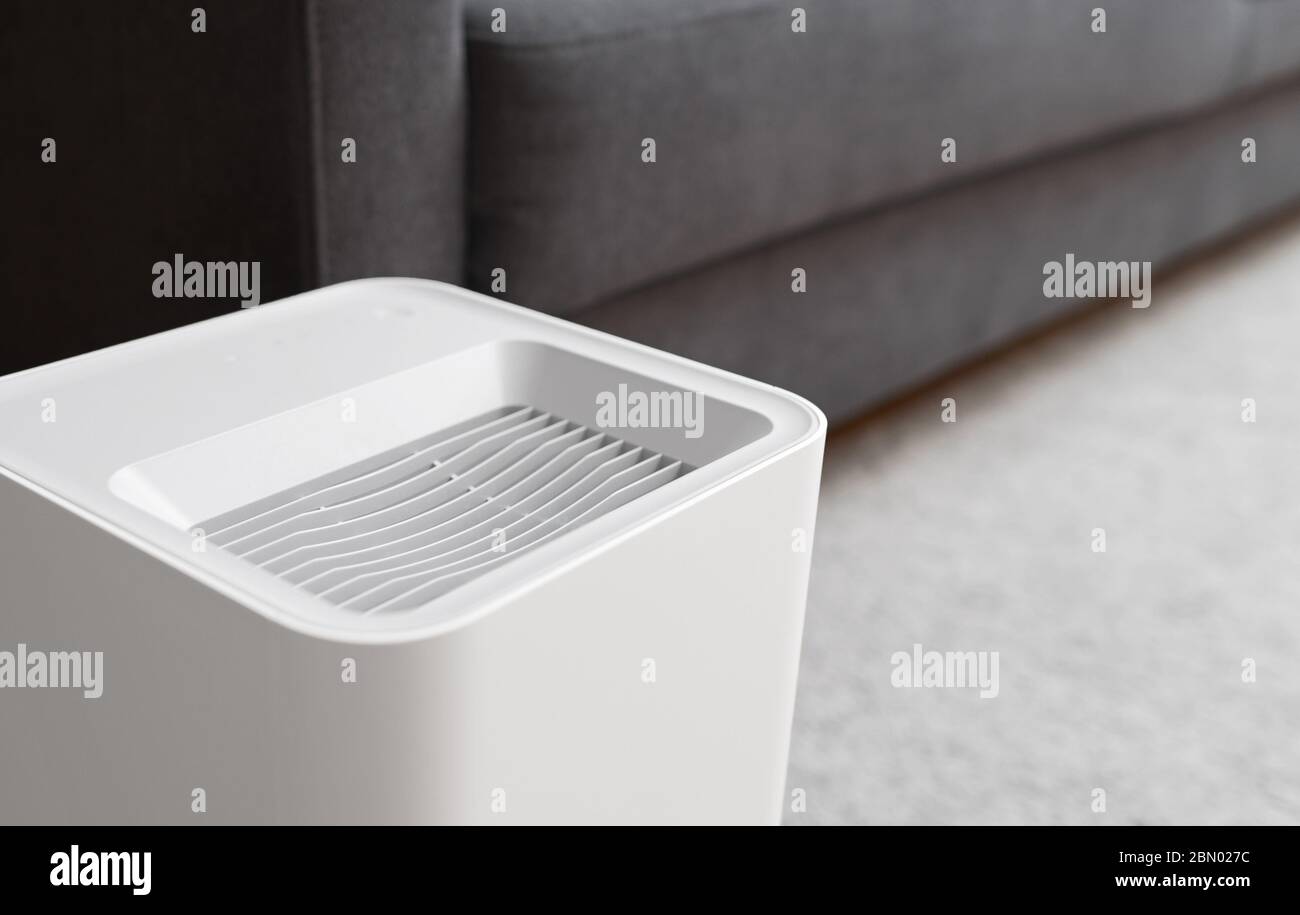 Air purifier in the room. Air washing system Stock Photo - Alamy