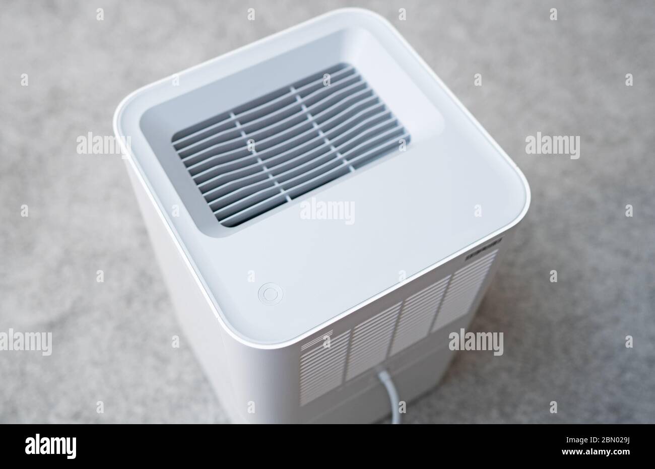 Air purifier in the room. Air washing system Stock Photo - Alamy