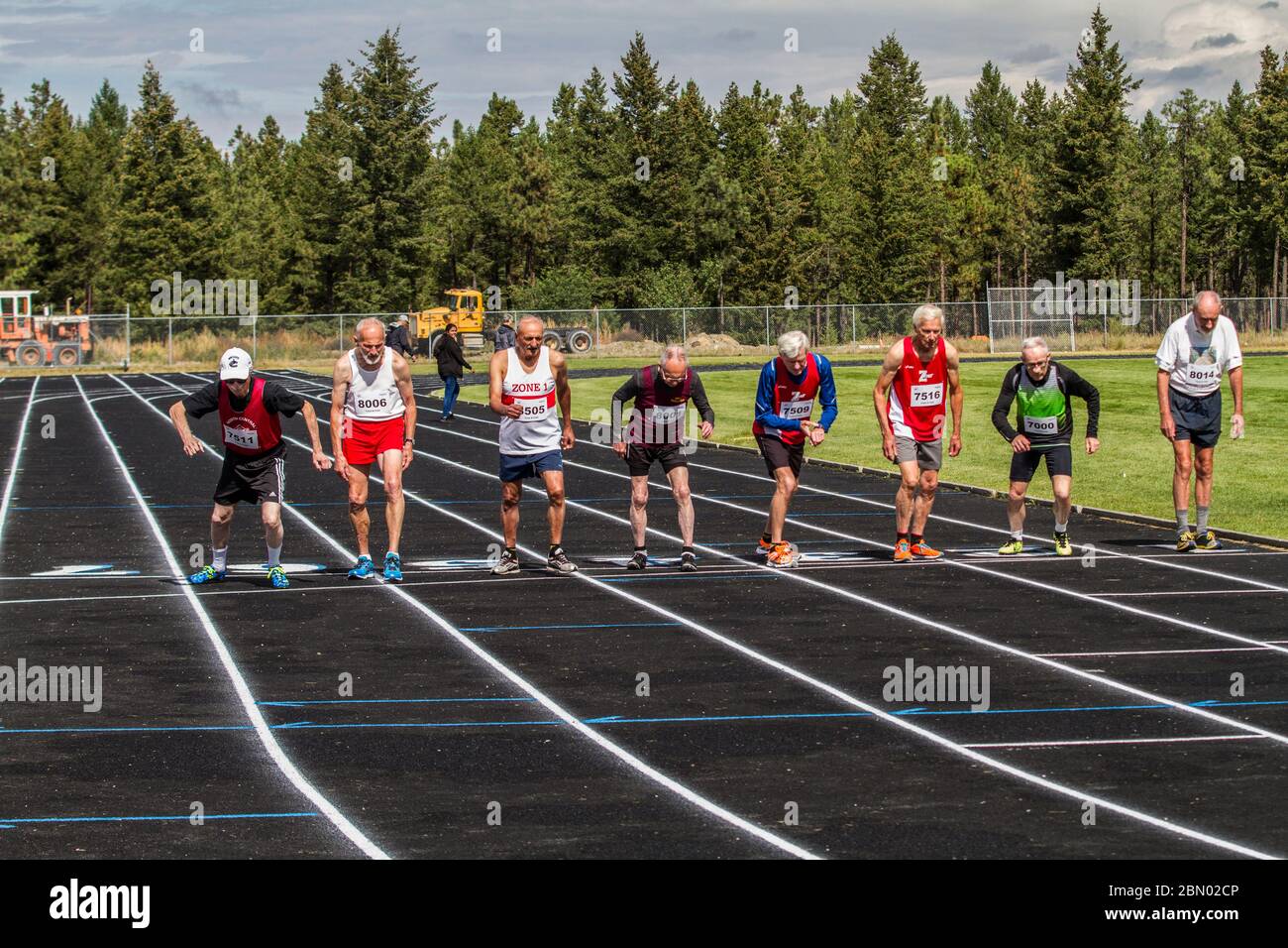 Senior Males( 65 to 80) competing in 200 M race. On starting line Stock ...