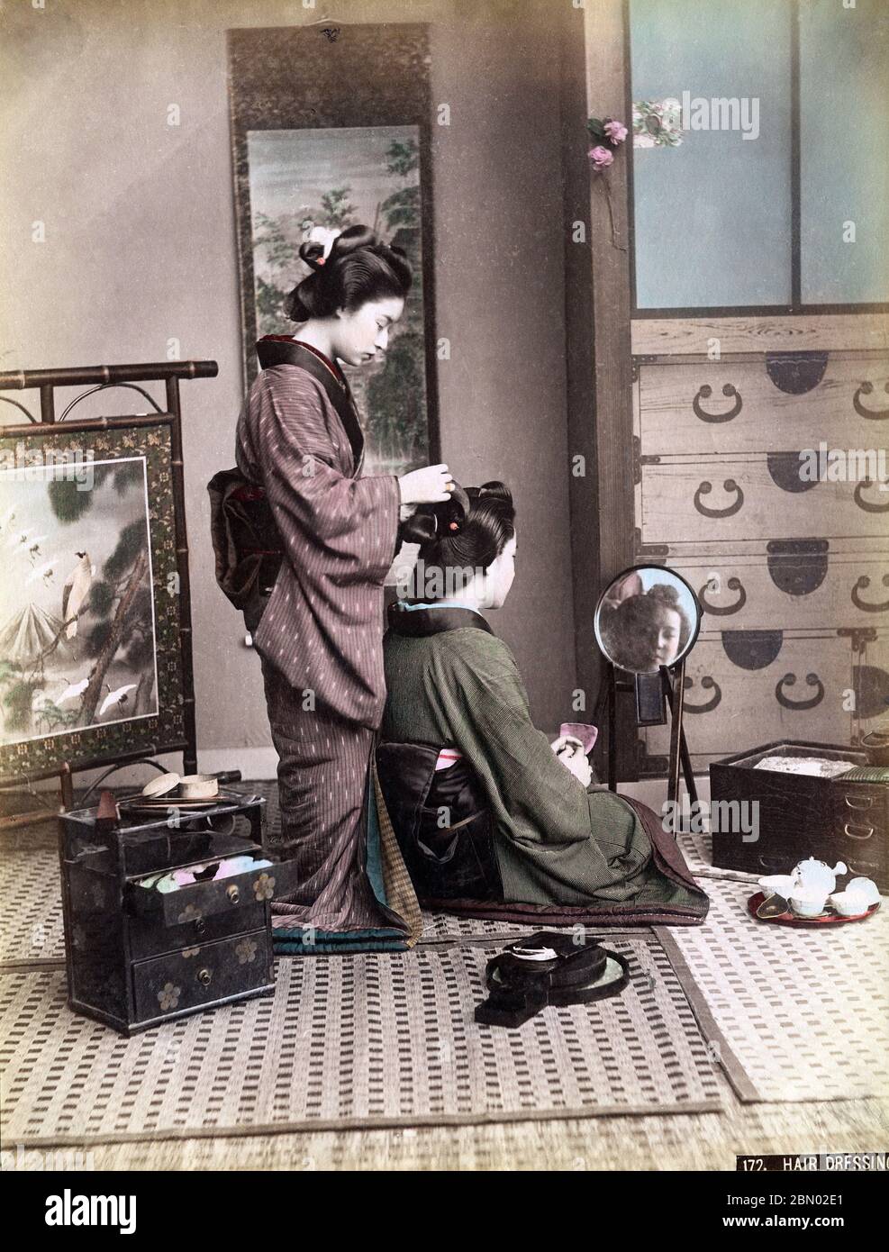 [ 1890s Japan - Japanese Hairdresser ] — A woman dressed in a kimono ...