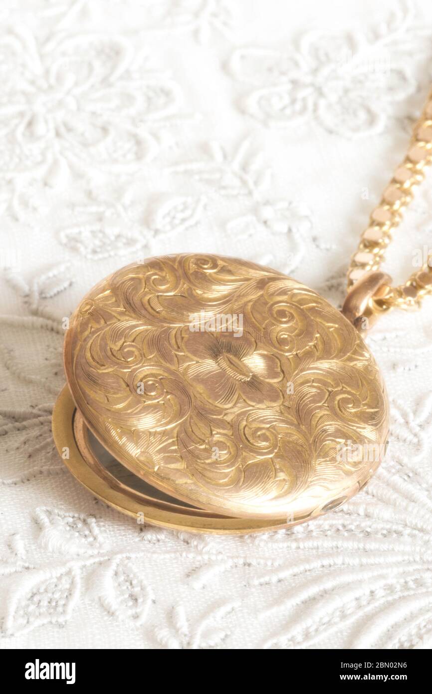 Gold locket hi-res stock photography and images - Alamy