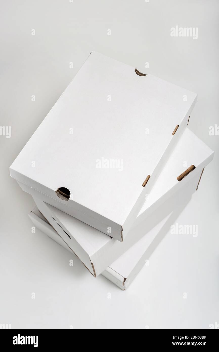Pile of blank white shoe boxes. View from above Stock Photo - Alamy