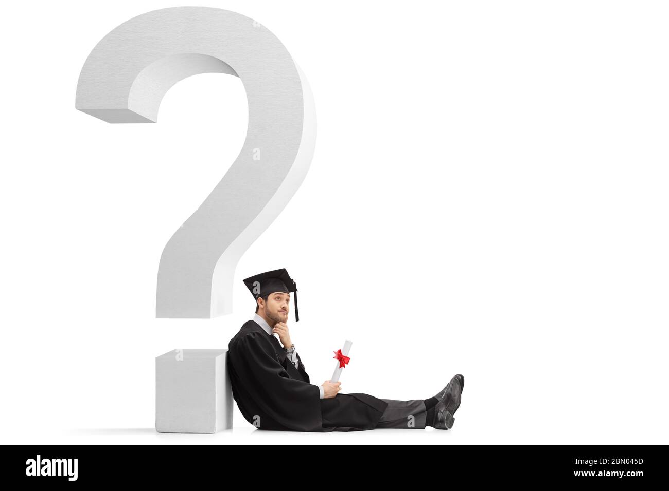 Male graduate student holding a diploma and leaning on a big question ...
