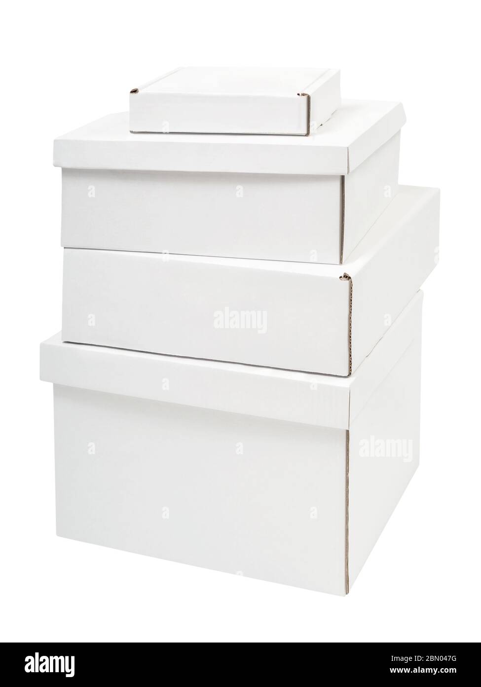 Pile of four blank white cardboard boxes of different sizes isolated on ...