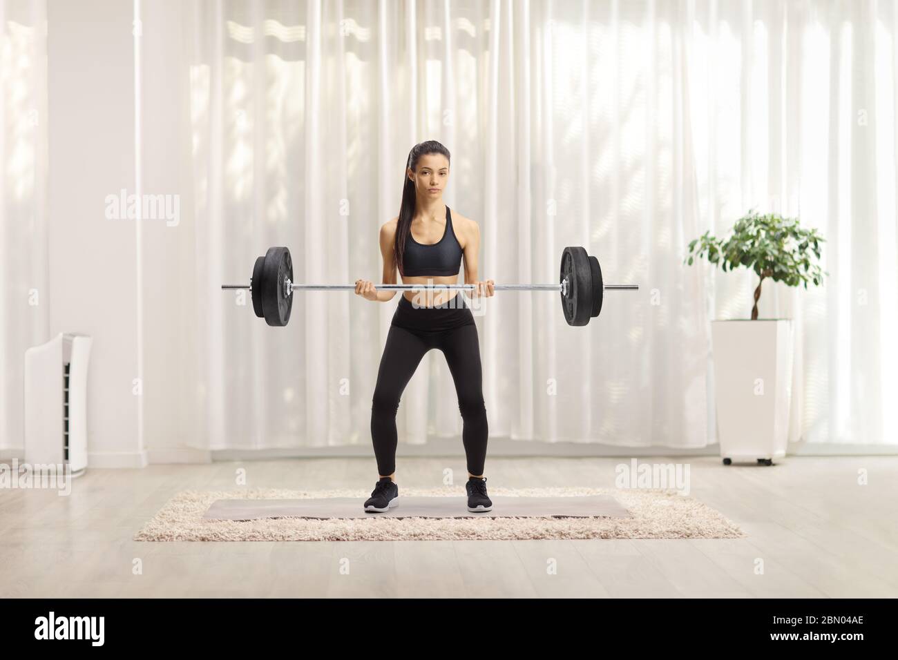 Young female athlete lifting hi-res stock photography and images - Alamy
