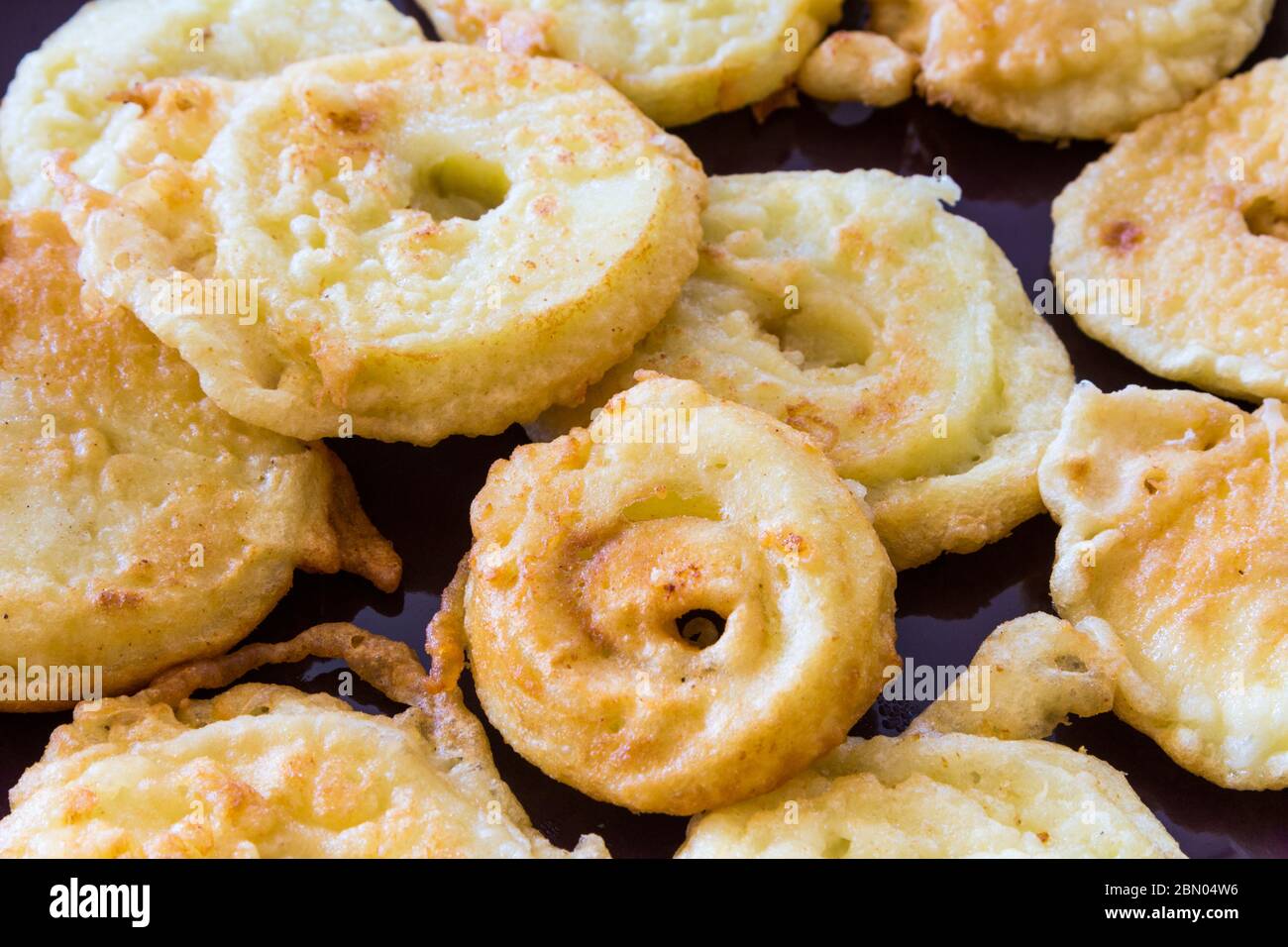 Fried battered apple fritters hi-res stock photography and images - Alamy