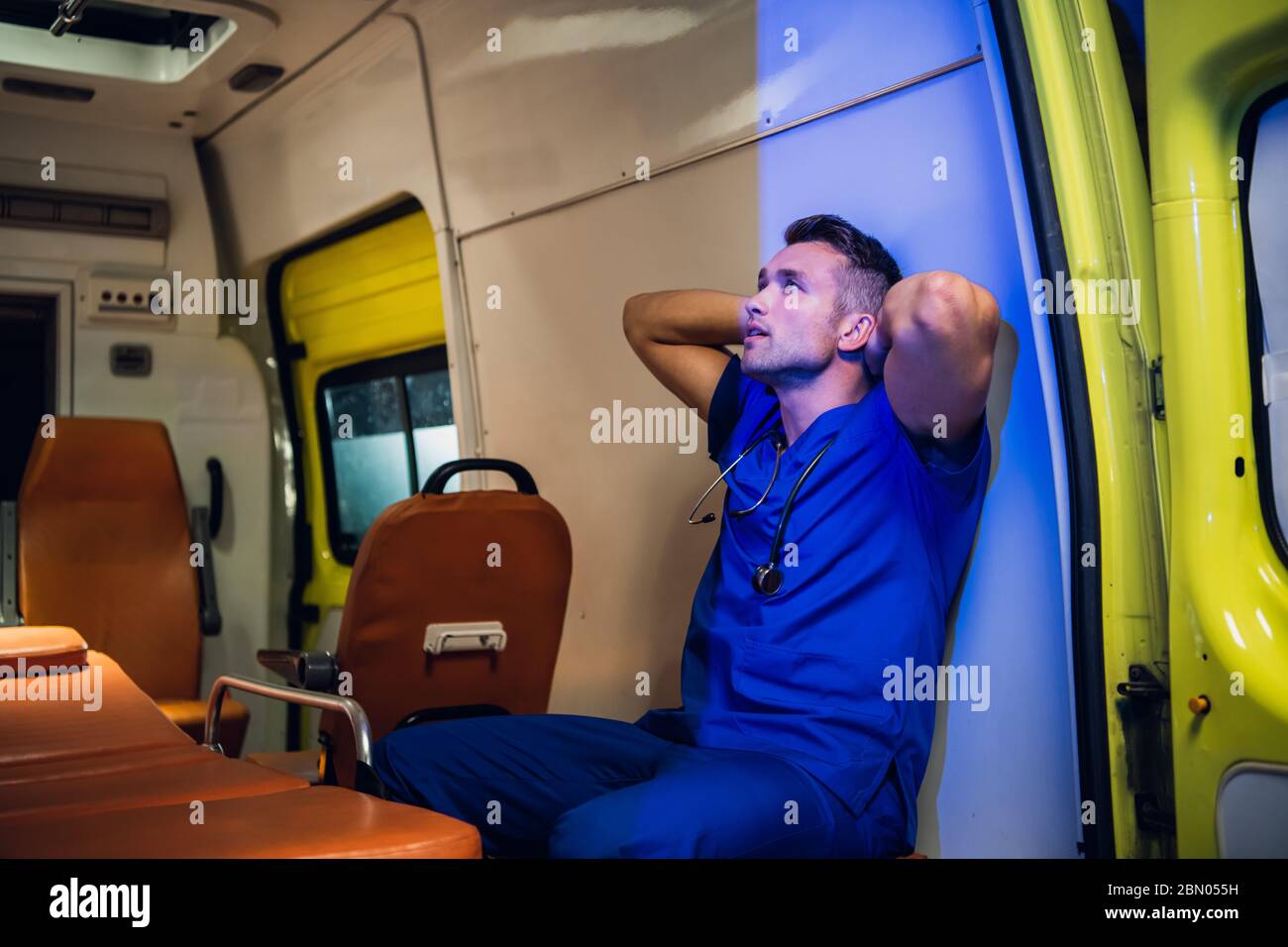 Corpsman having a little rest, sitting in an ambulance car Stock Photo ...
