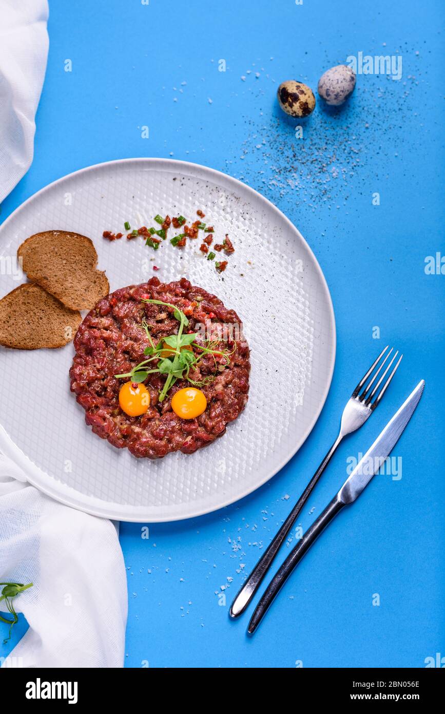 Steak Tartare, raw beef chopped and served with a quail eggs ...