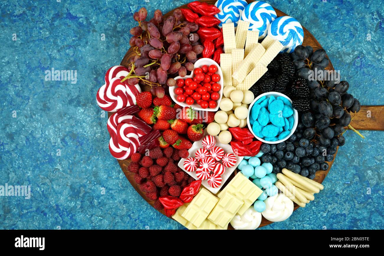 Patriotic red white and blue charcuterie dessert grazing platter with ...