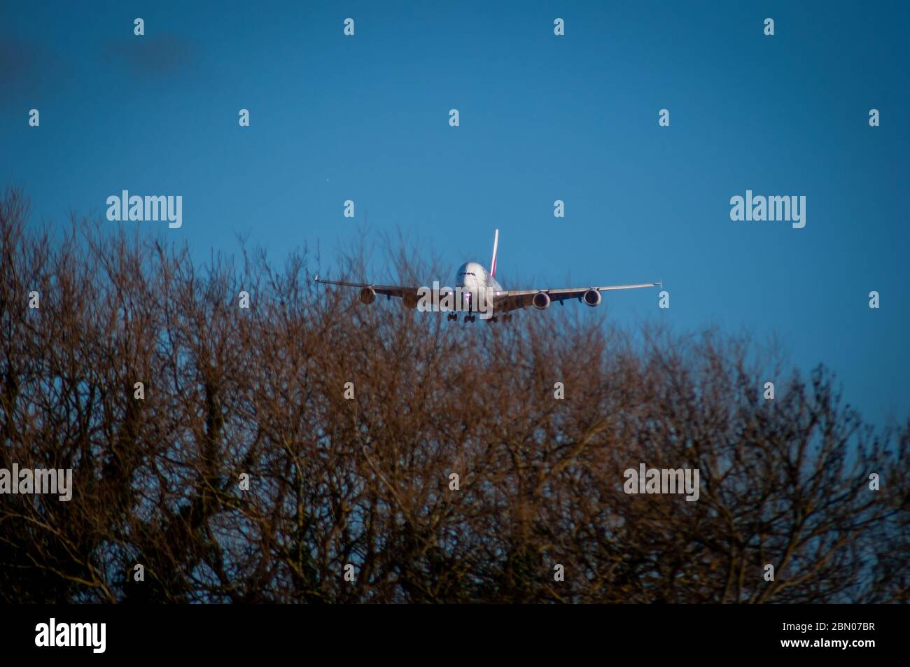 An Emirates Airbus A380 on final approach to heathrow 27R runway with ...