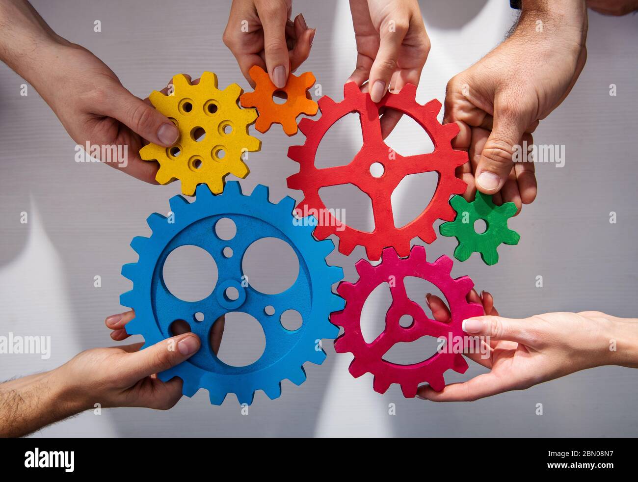 Business team connect pieces of gears. Teamwork, partnership and ...