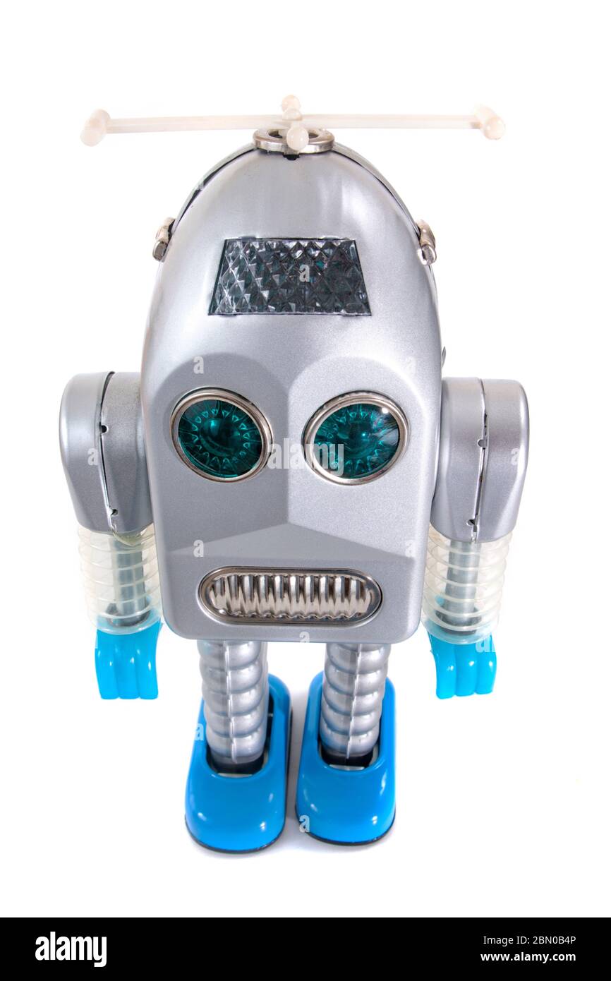 Vintage tin robot toy isolated on a white background Stock Photo - Alamy