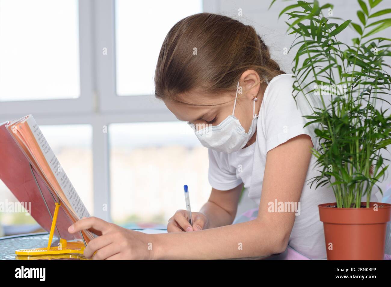 A sick girl teaches homework and does homework Stock Photo - Alamy