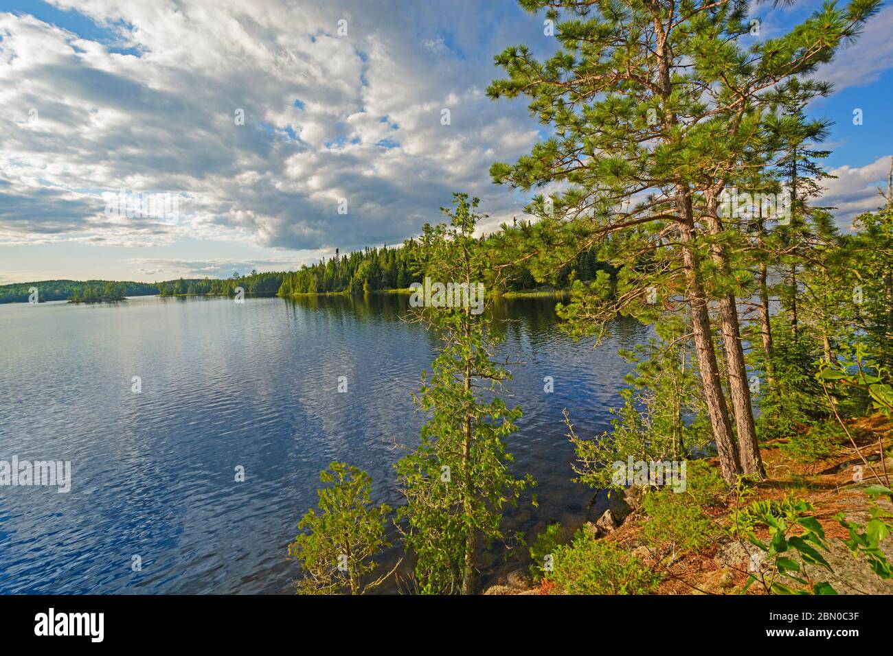 Sun and Clouds in the North Woods on Saganagons Lake in Quetico ...