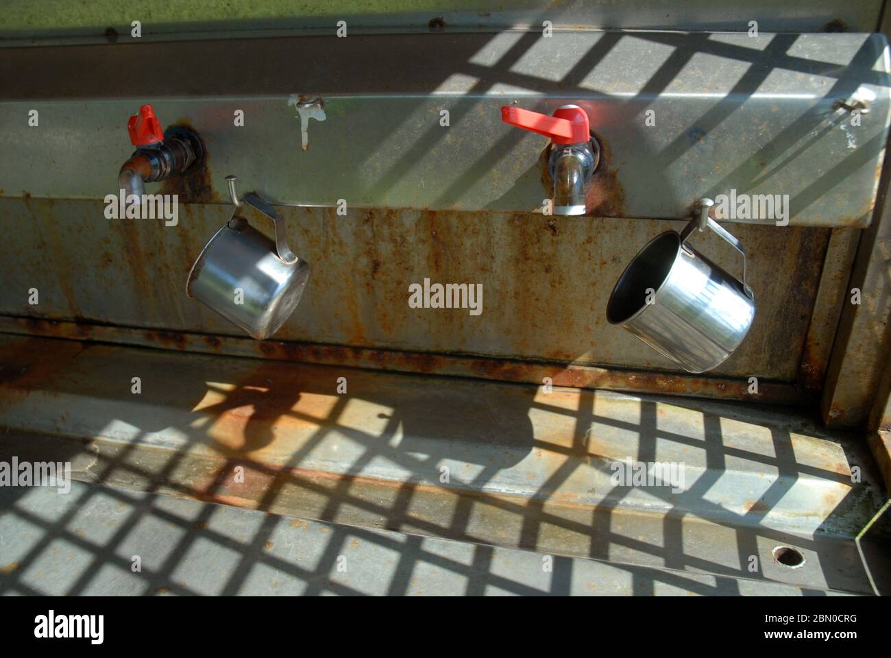 Tap and Empty Water Cups, Yangon, Myanmar Stock Photo - Alamy