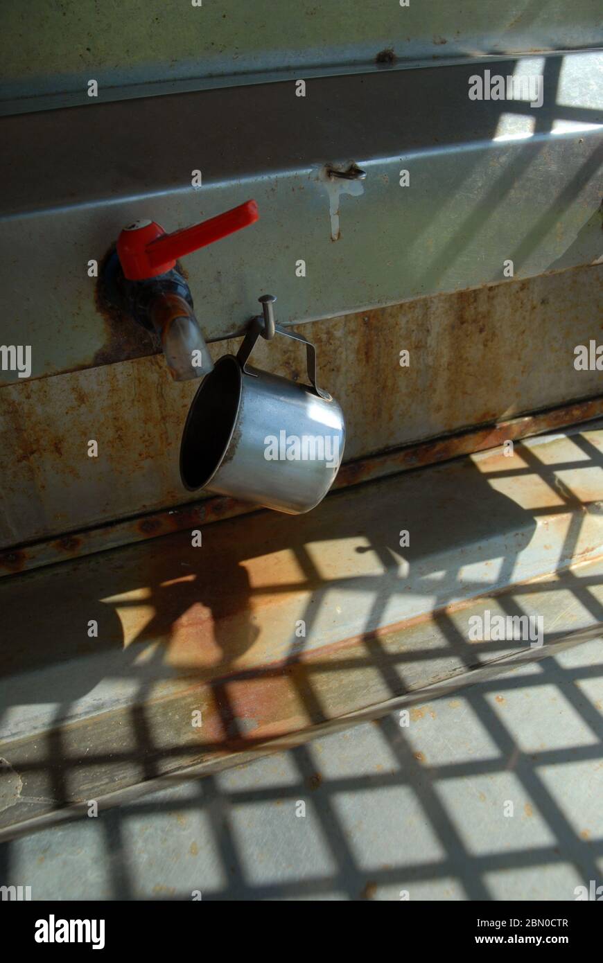 Tap and Empty Water Cups, Yangon, Myanmar Stock Photo - Alamy