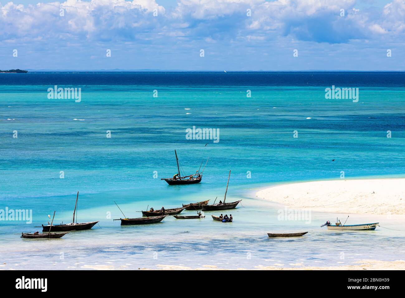 Fishing boats in turquoise green water on the beach of Kendwa, Zanzibar ...