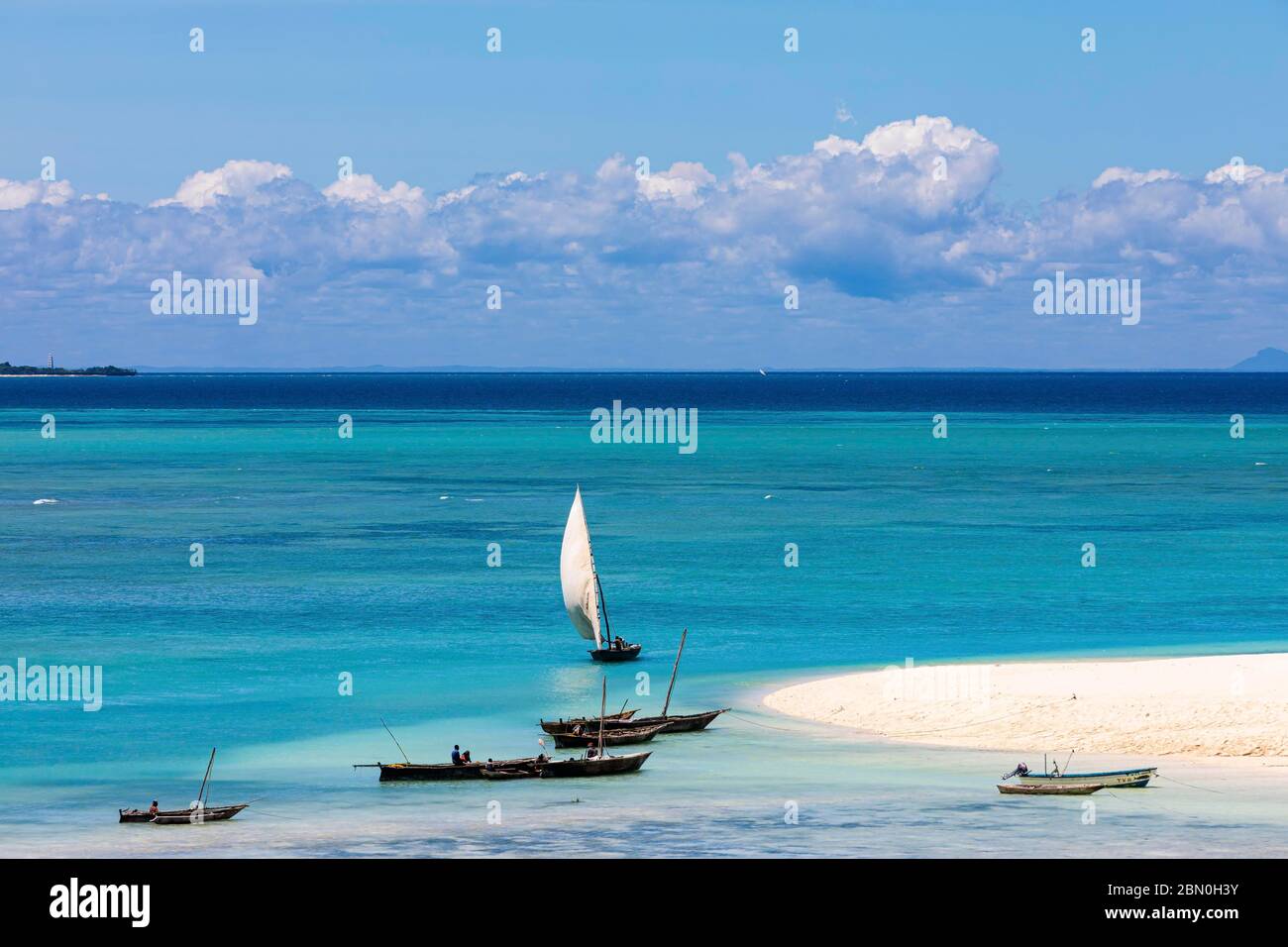 Fishing boats in turquoise green water on the beach of Kendwa, Zanzibar ...
