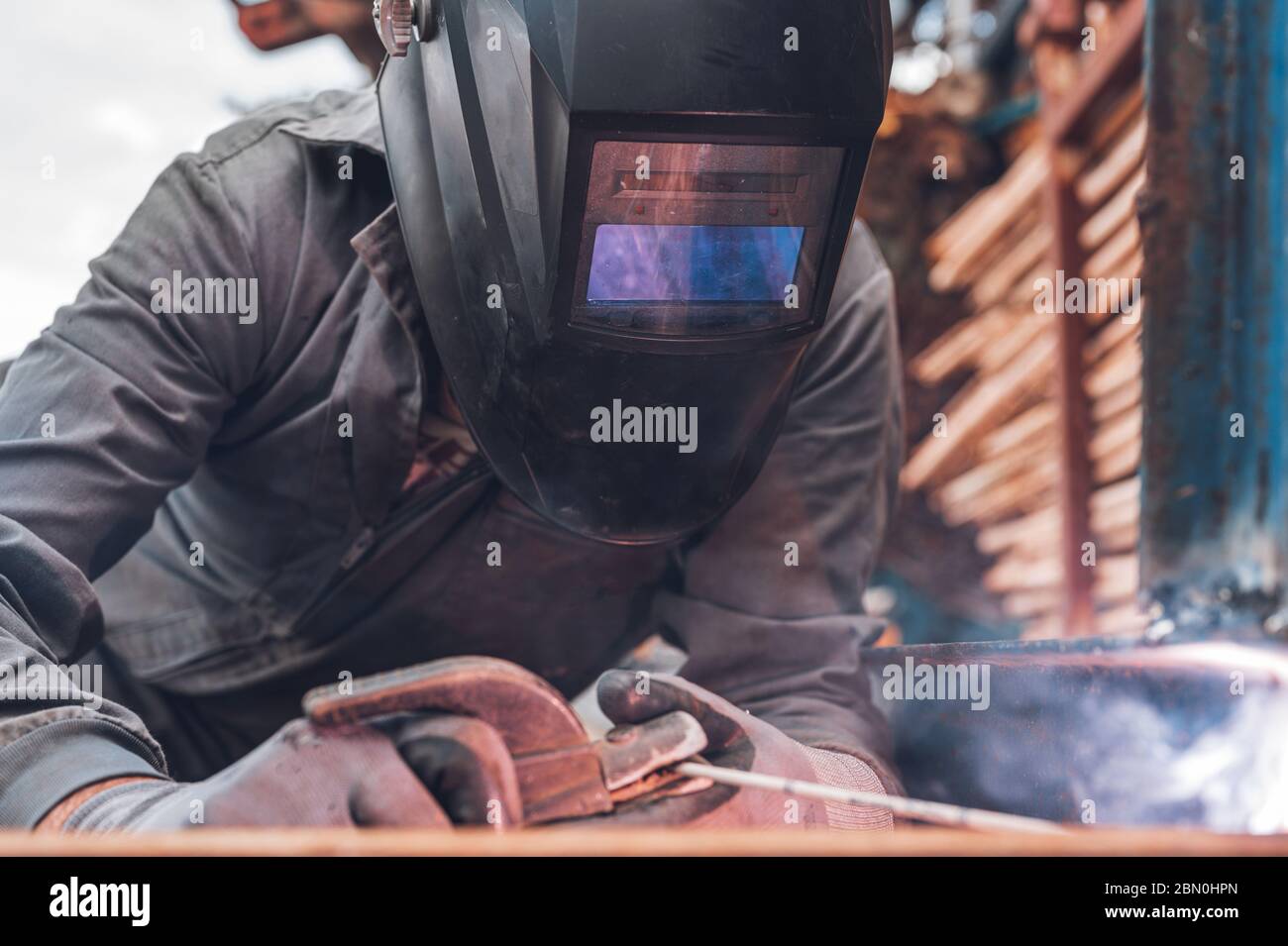 Welding work, Man Welding in Workshop. Metalwork and Sparks ...