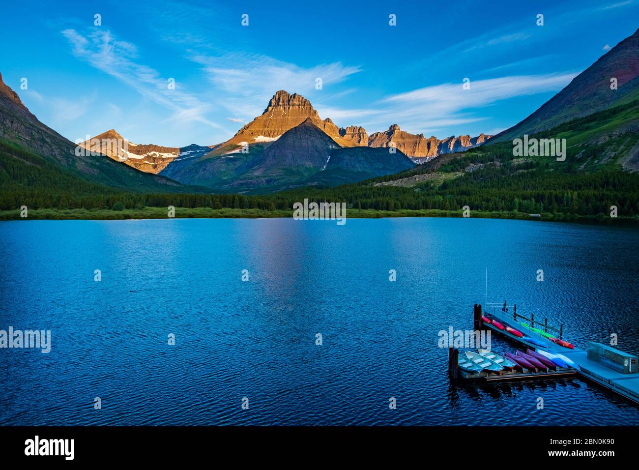2570 Morning sun begins to brighten Mount Wilbur at Swiftcurrent Lake ...