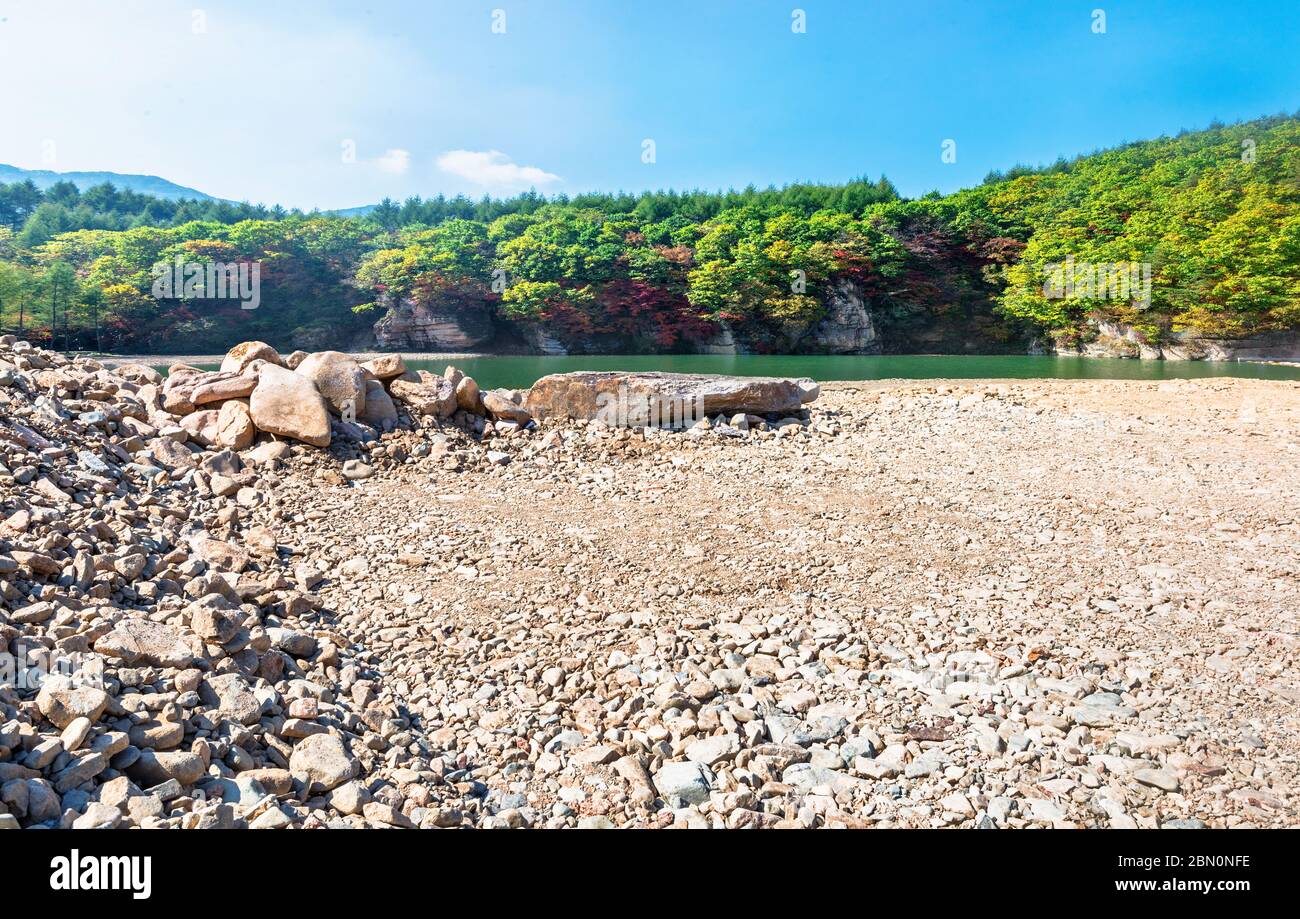 Empty rocky pavement and clean and comfortable autumn natural landscape ...