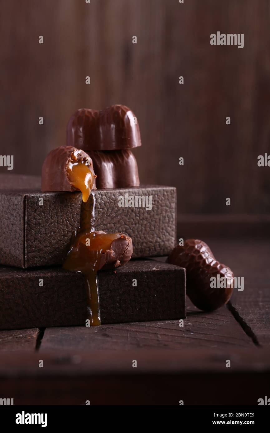 chocolate candies pralines with caramel Stock Photo - Alamy
