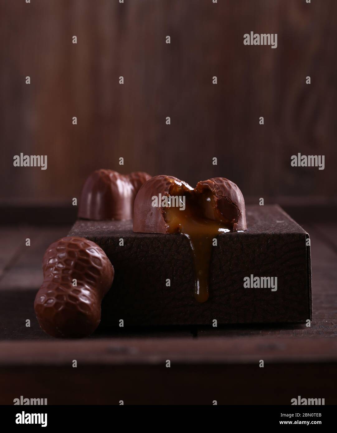 chocolate candies pralines with caramel Stock Photo - Alamy