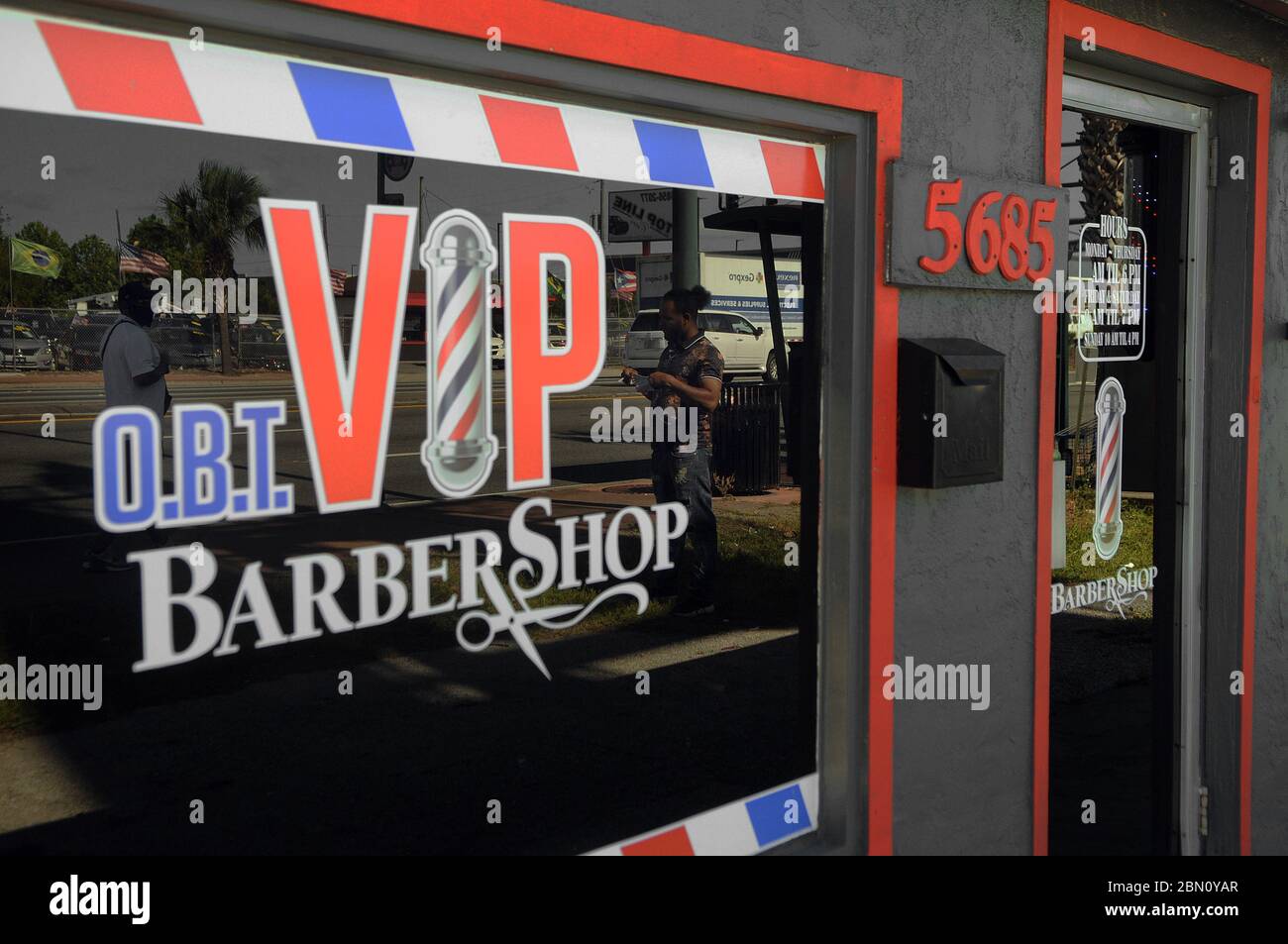 Orlando, United States. 11th May, 2020. Customers' reflections are seen ...