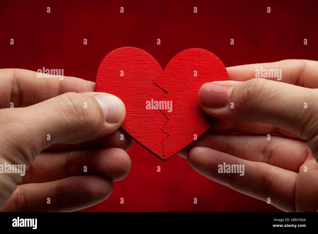 Two halves of one heart. A man and a woman connect a heart together ...