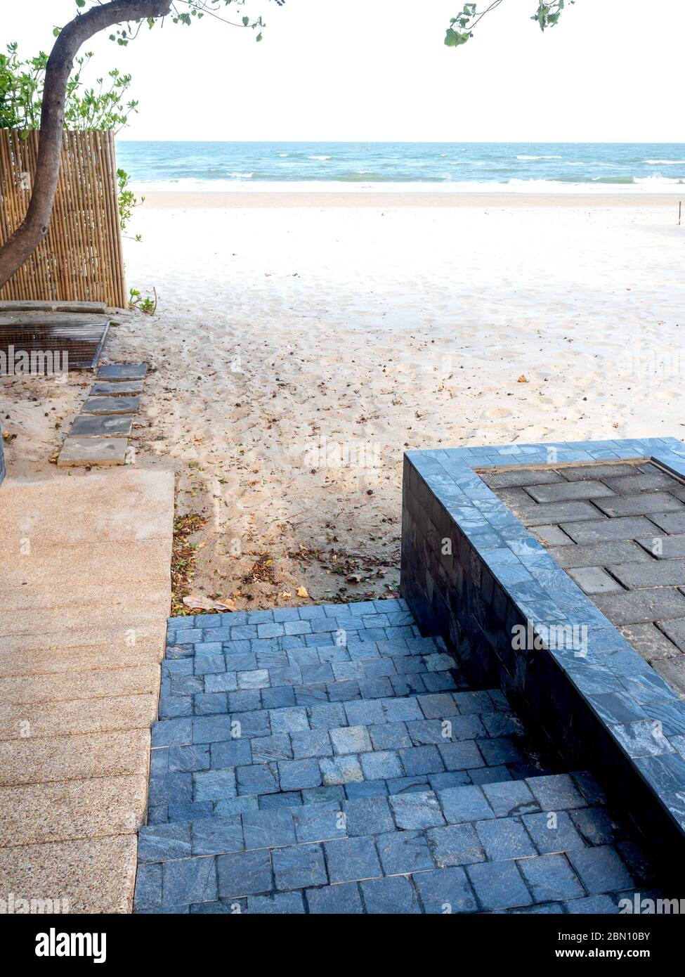 Stone stairway to the beach with seascape view background, vertical ...