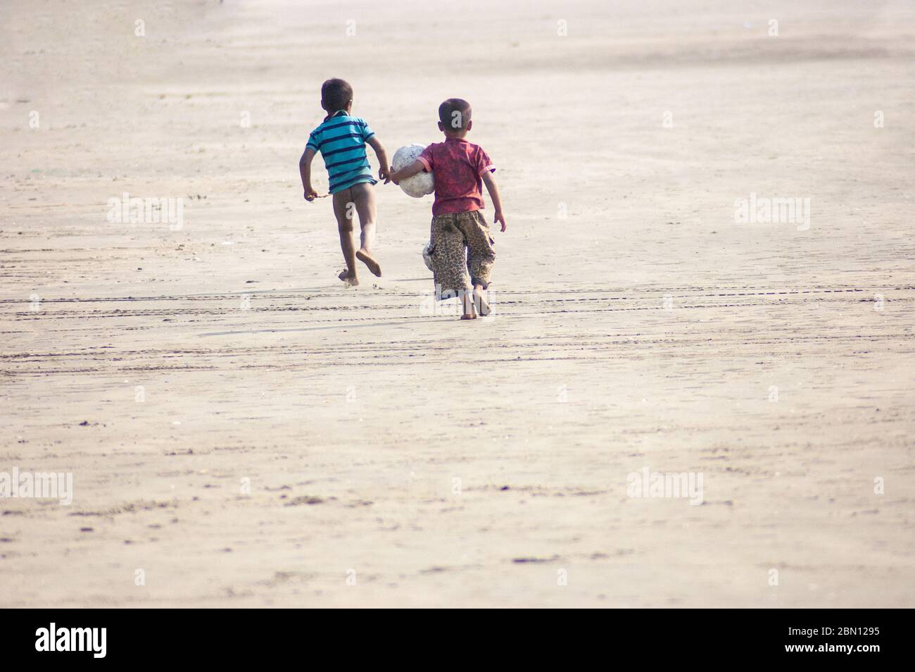 Happy boys running hi-res stock photography and images - Alamy