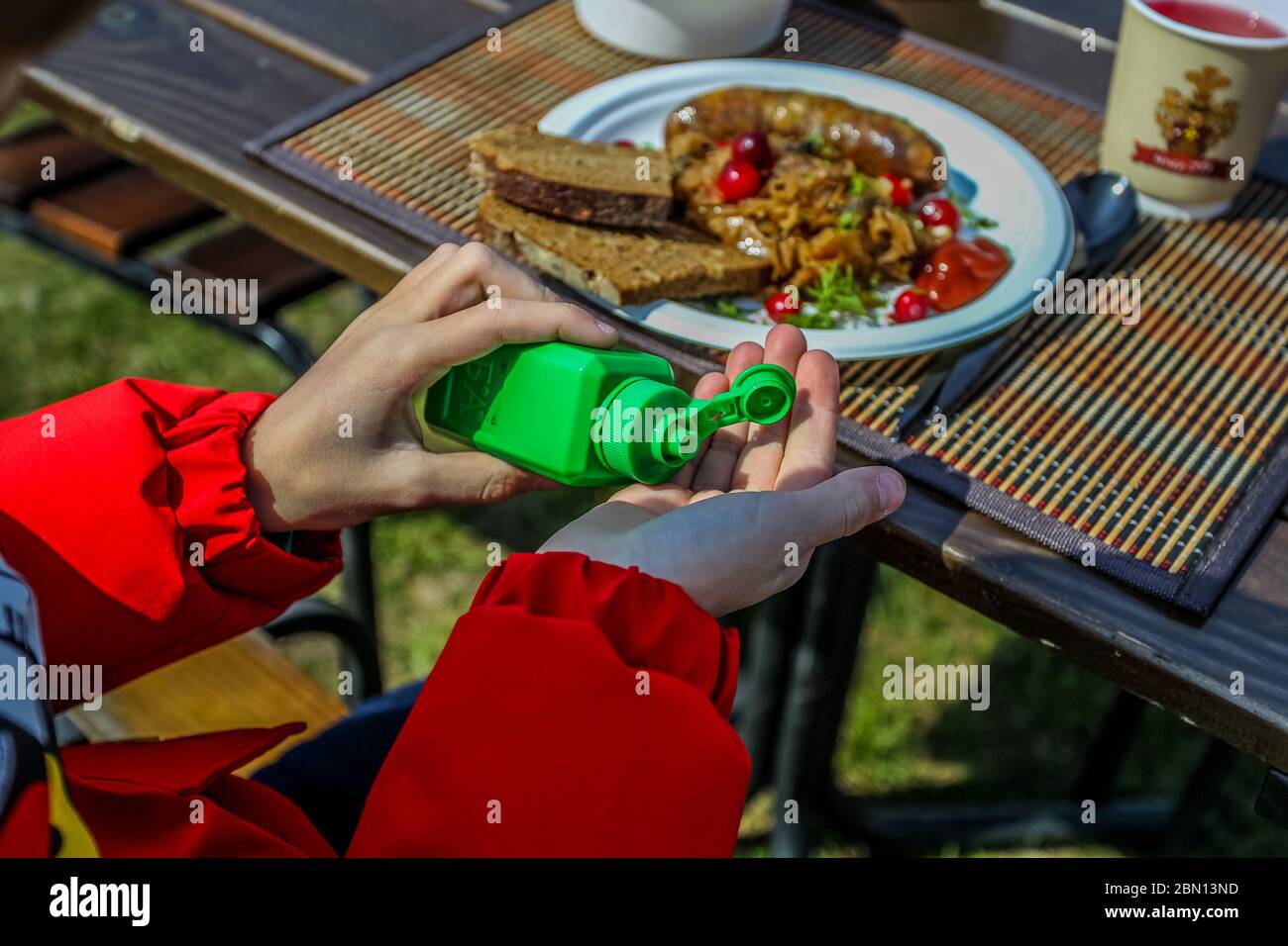 Hand disinfection before a meals Stock Photo - Alamy