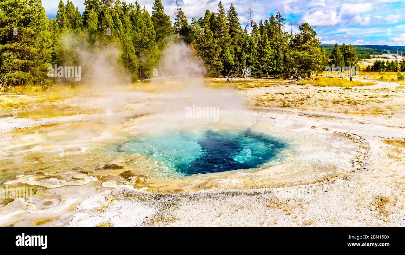 The turquoise colored Spasmodic Geyser in the Upper Geyser Basin along ...