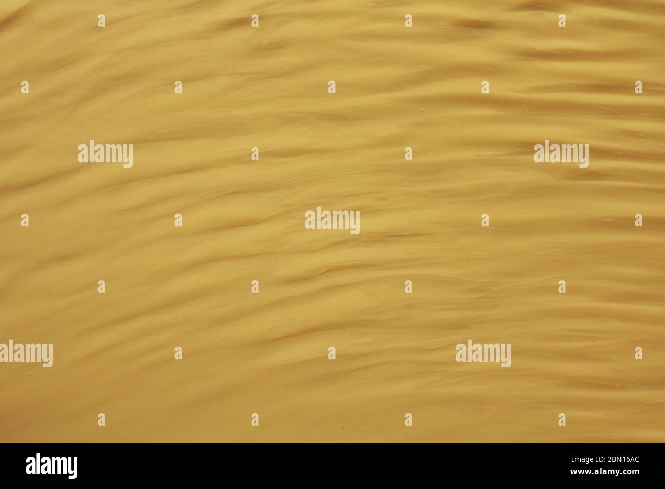 Yellow wavy striped background. Waves and ripples on the water. Place ...